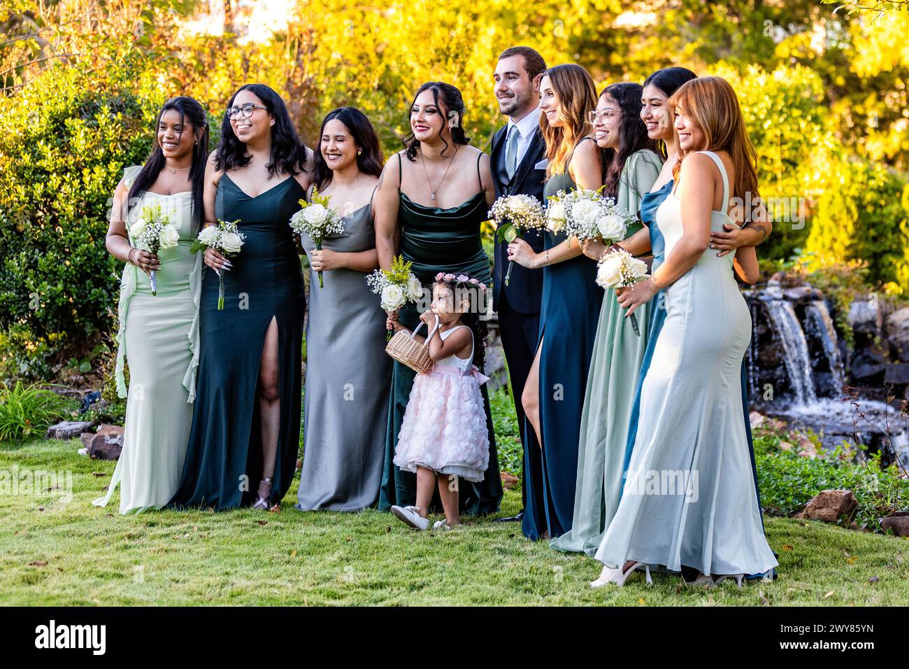 guests and bridesmaids posing for group photo at wedding Stock Photo ...