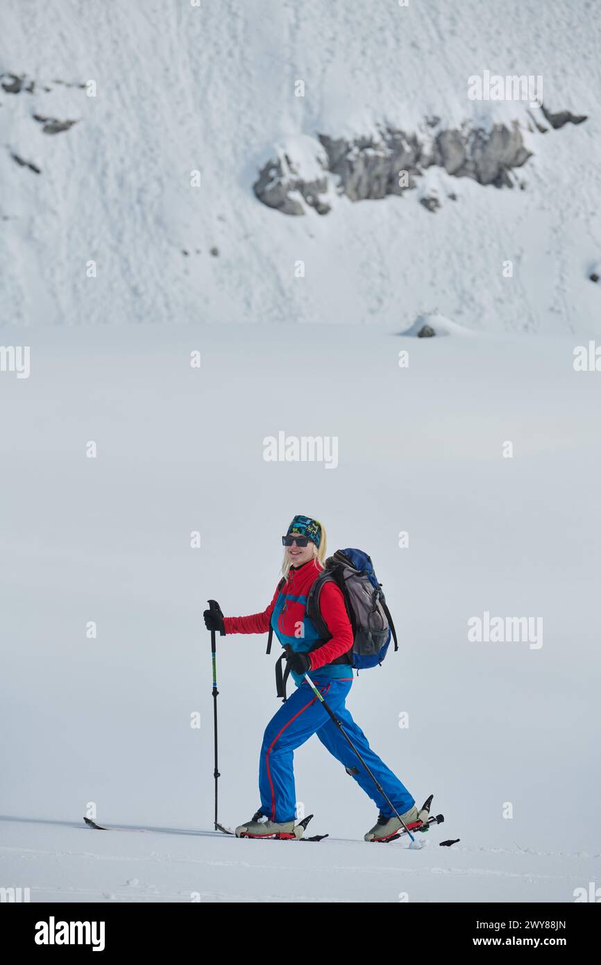 A Female Mountaineer Ascends the Alps with Backcountry Gear Stock Photo ...