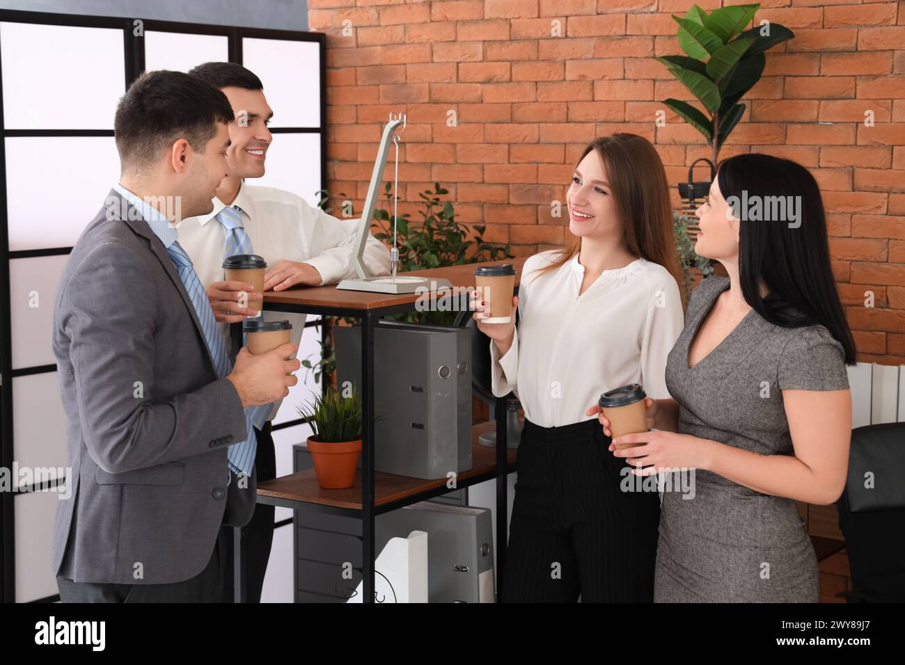 Business colleagues having coffee break in office Stock Photo - Alamy