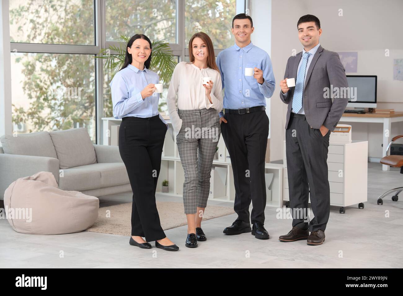Business colleagues having coffee break in office Stock Photo - Alamy