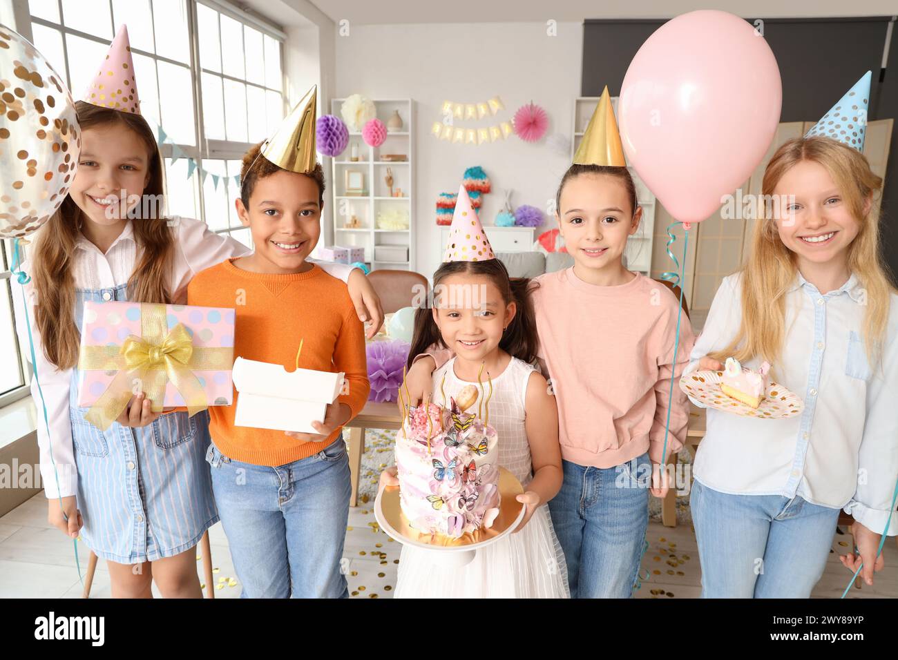 Cute little children with Birthday cake and gifts at party Stock Photo ...