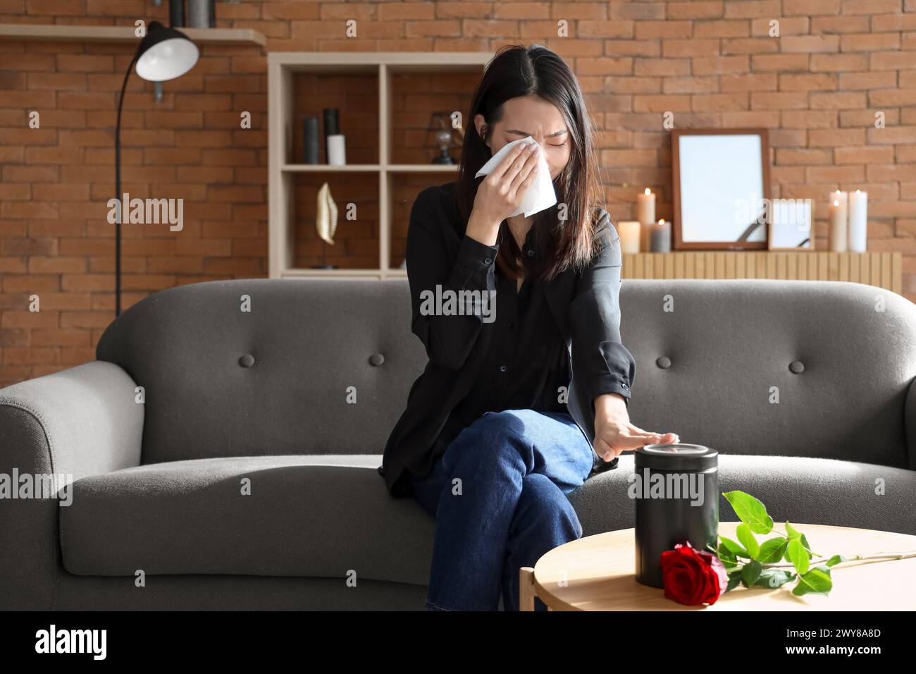 Grieving young Asian woman crying at funeral Stock Photo - Alamy