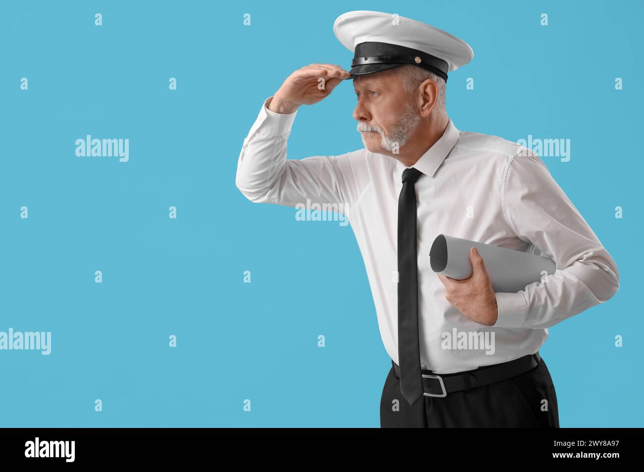 Mature sailor with world map on blue background Stock Photo - Alamy