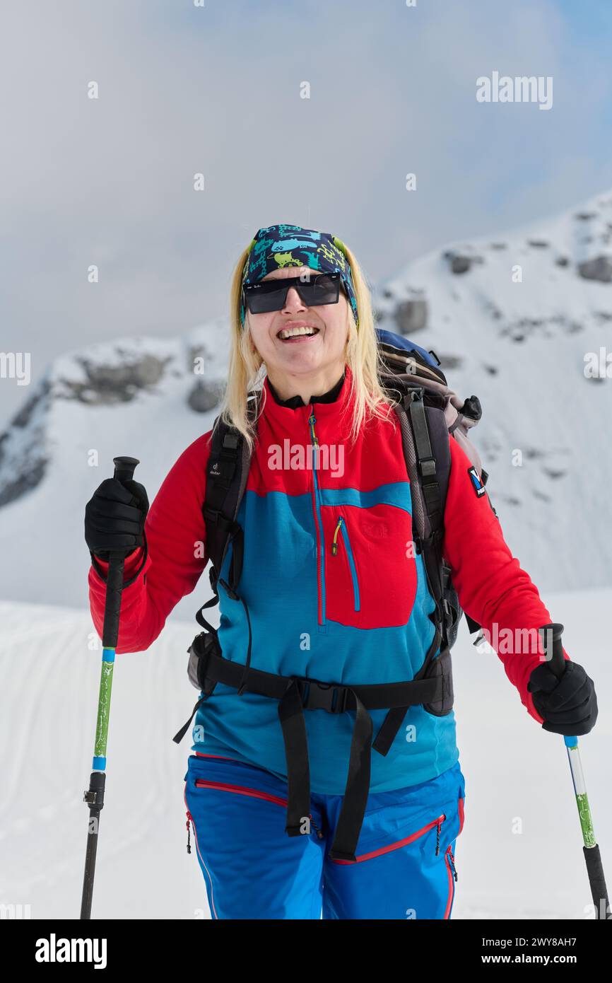 A Female Mountaineer Ascends the Alps with Backcountry Gear Stock Photo ...