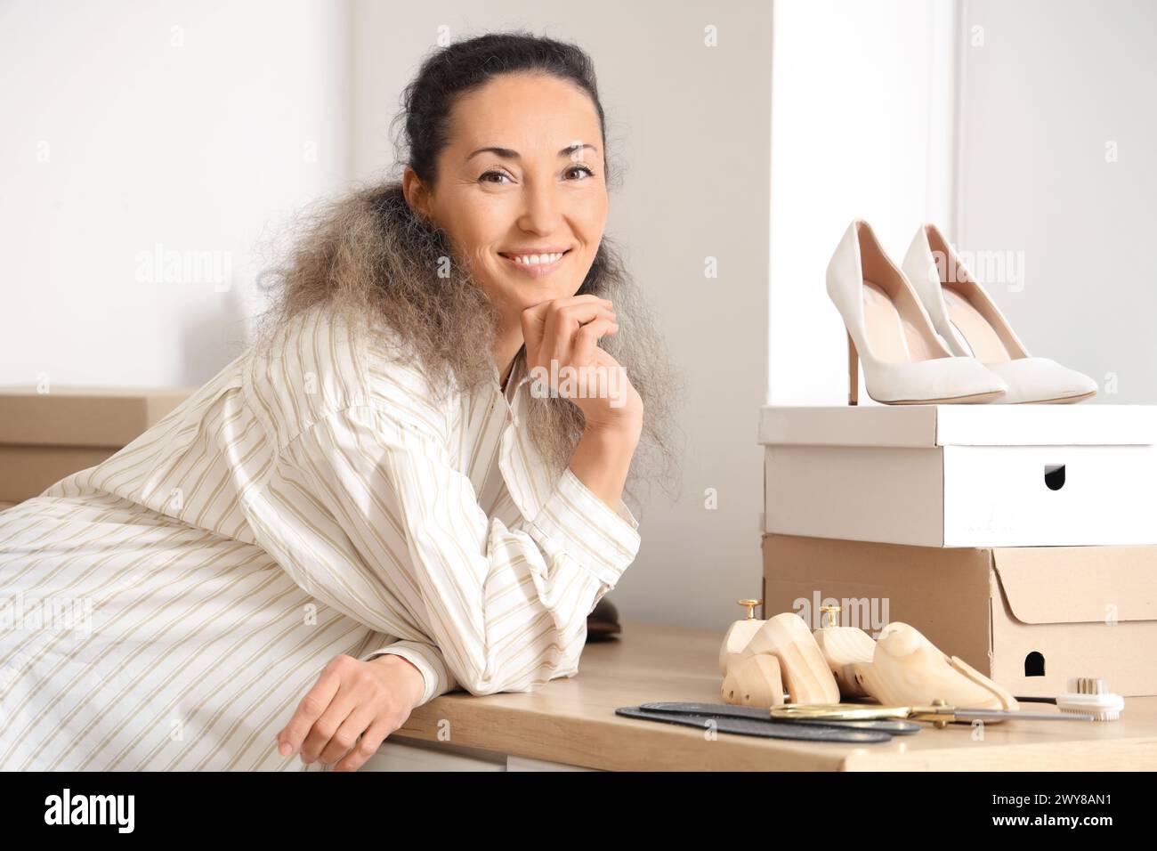Female shoemaker table in hi-res stock photography and images - Alamy