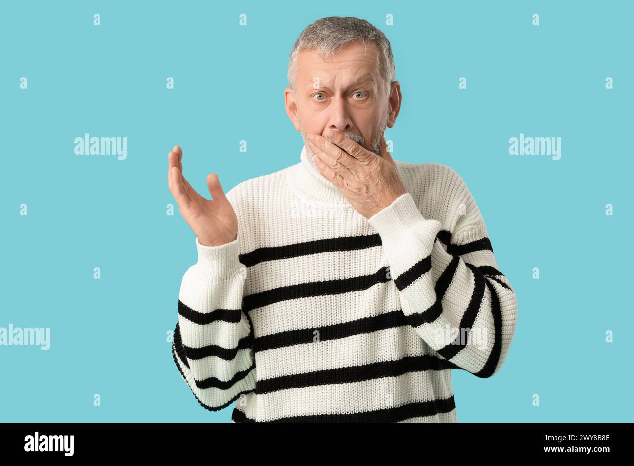 Shocked senior man on blue background Stock Photo - Alamy
