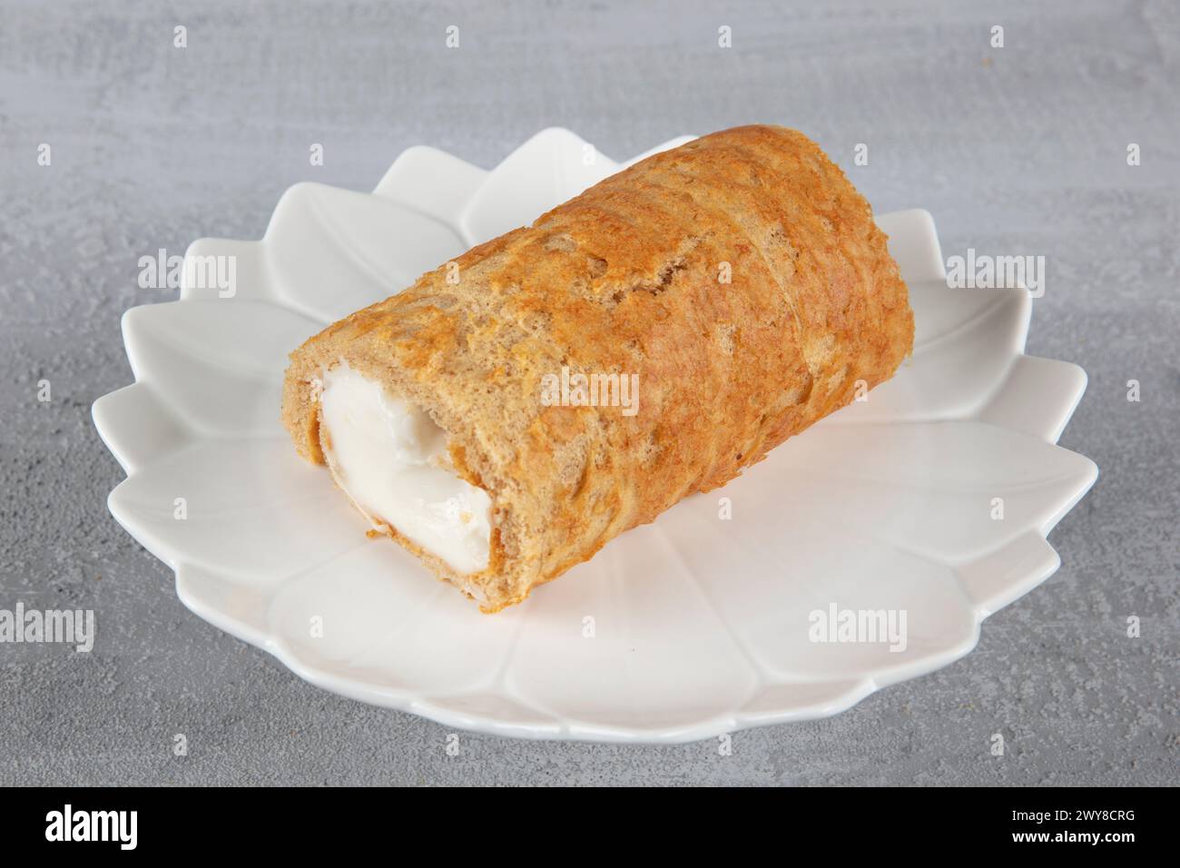 Sweet roll cake with slice. Banana roll cake. Chocolate and banana cake ...