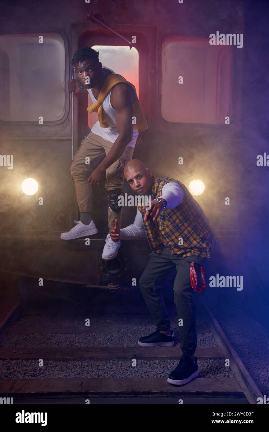 Cool young guys rappers shooting video in misty subway underground ...