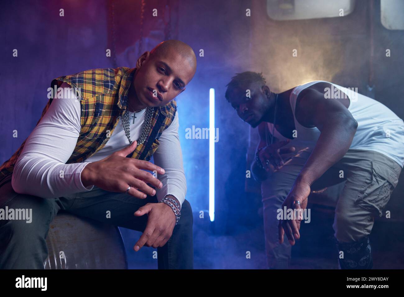 Cool two friends rappers freestyling together in modern garage studio ...