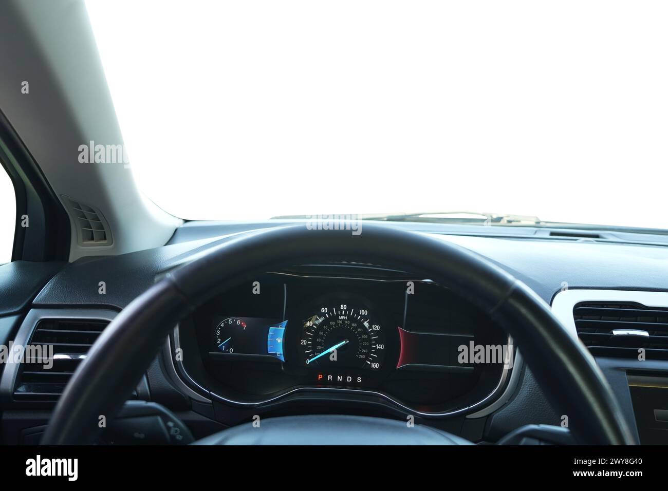 Speedometer on dashboard and steering wheel inside car Stock Photo - Alamy
