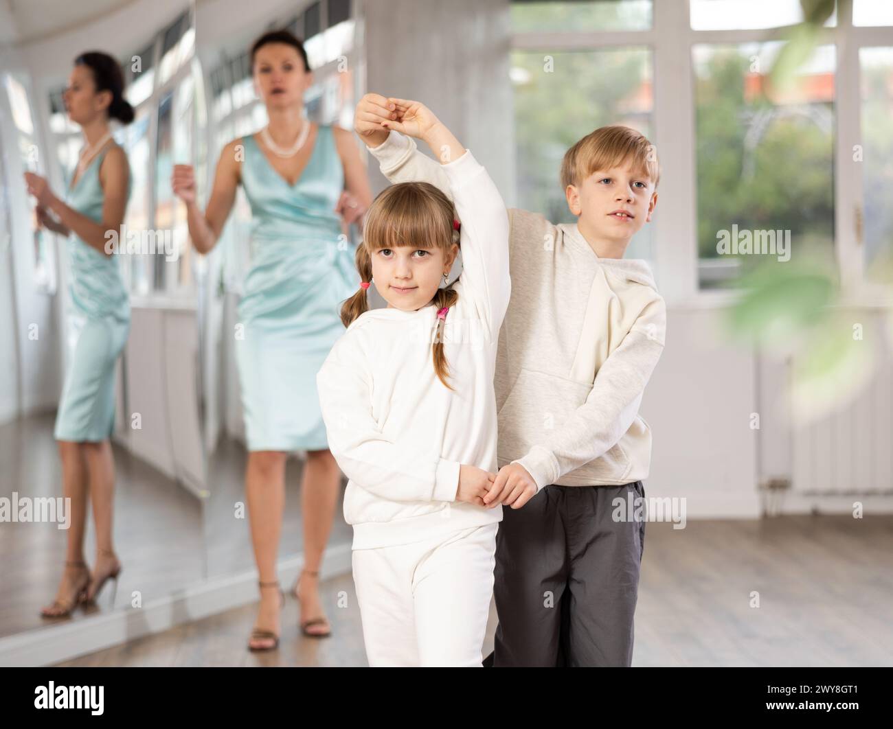 Tween dancers, girl and boy practicing waltz in dance studio Stock ...