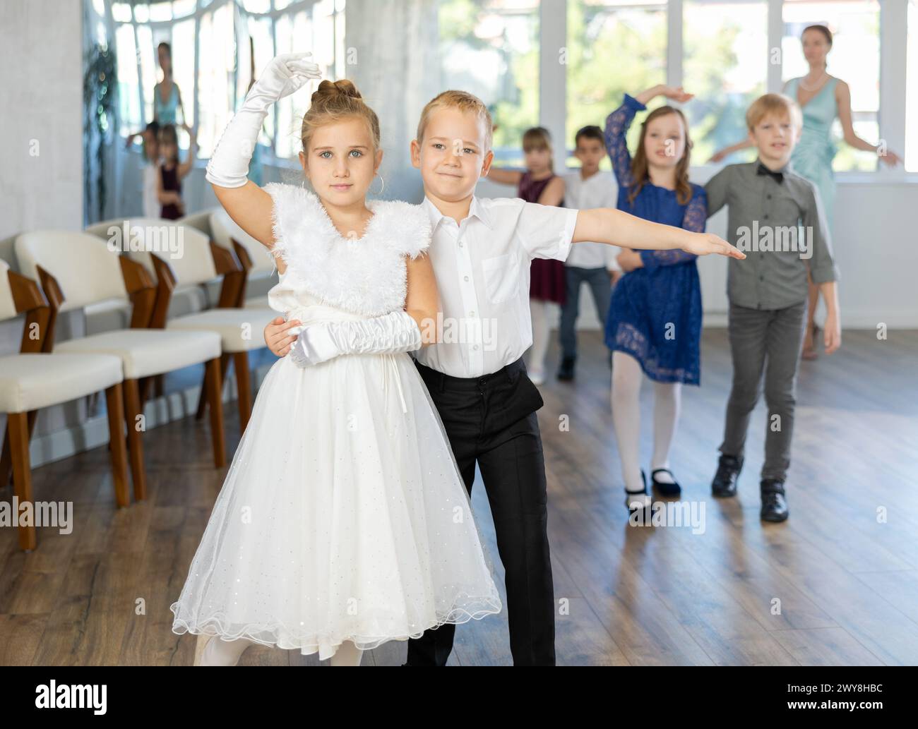 Classical dances performed by preteen children in festive clothes Stock ...