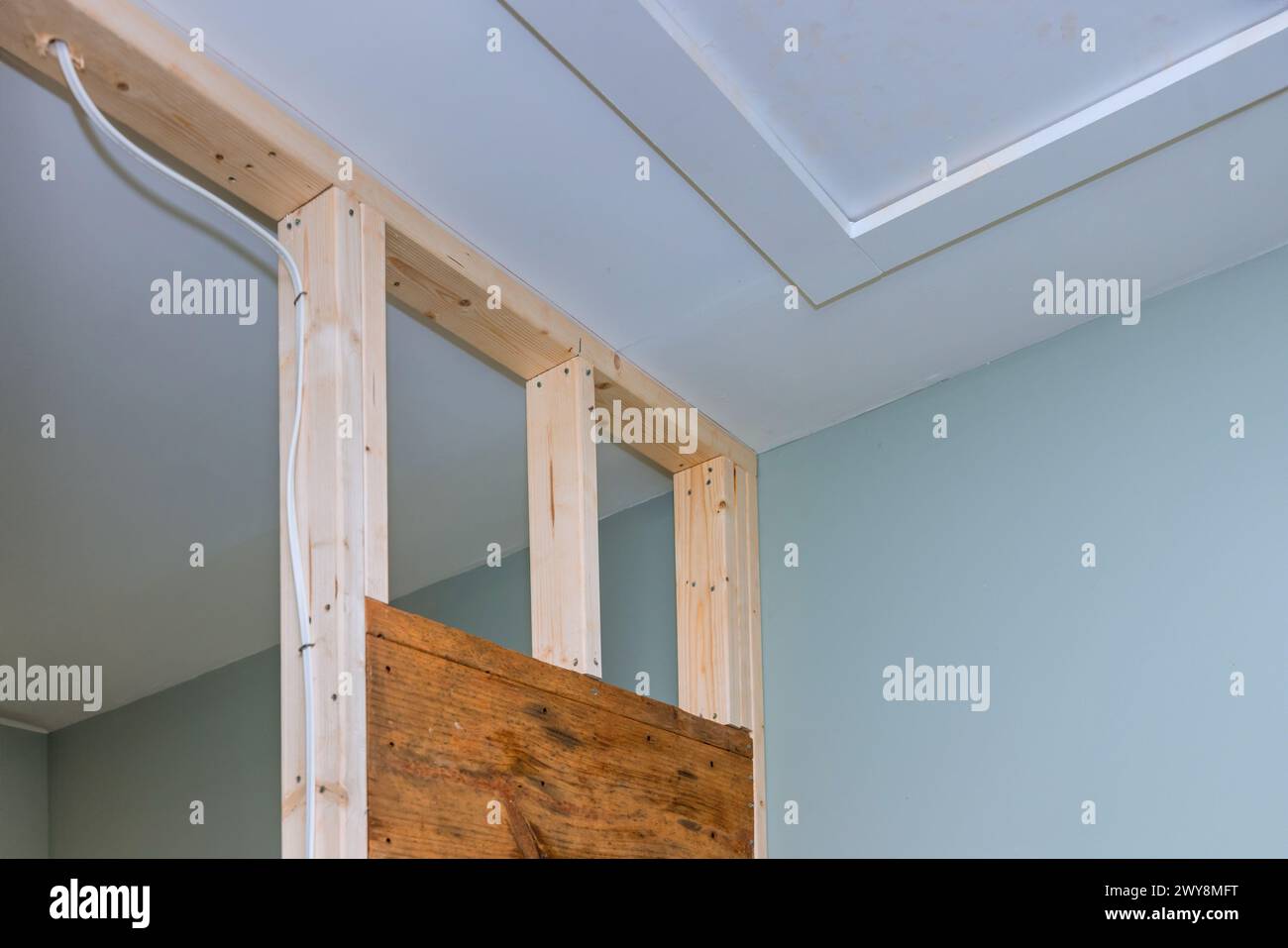 Drywall screwing plasterboard mounting to wooden beams at wall Stock ...