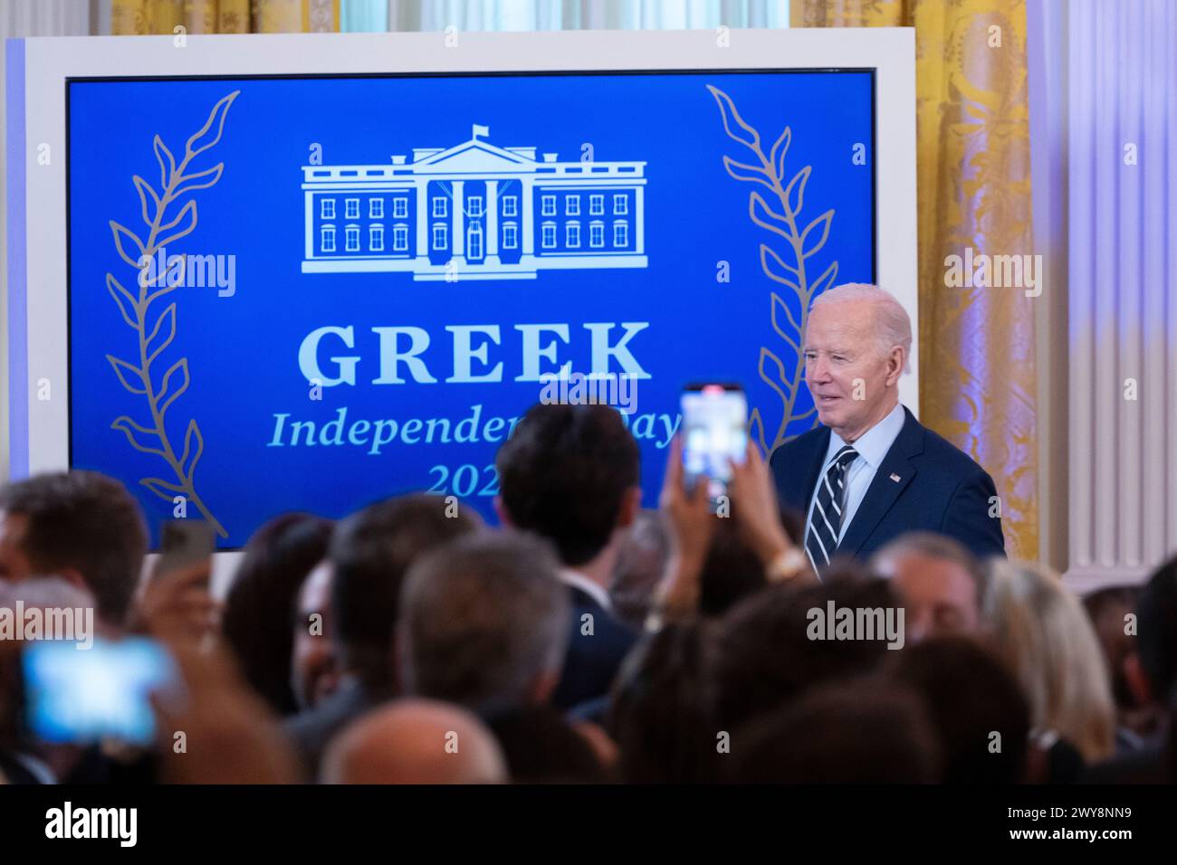 United States President Joe Biden walks to greet guests during a ...