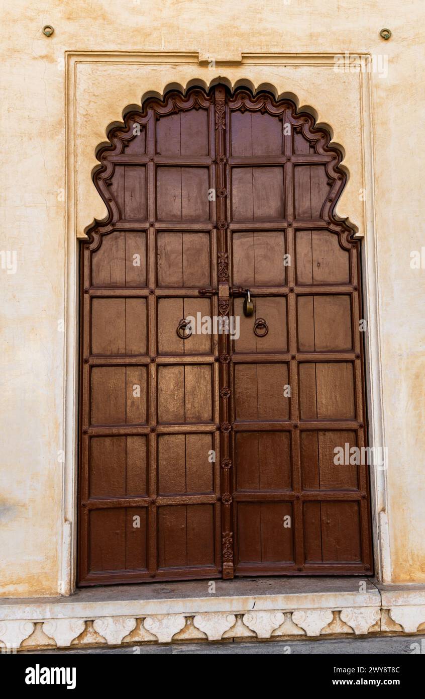 artistic wood door of ancient fort at morning image is taken at Kumbhal ...