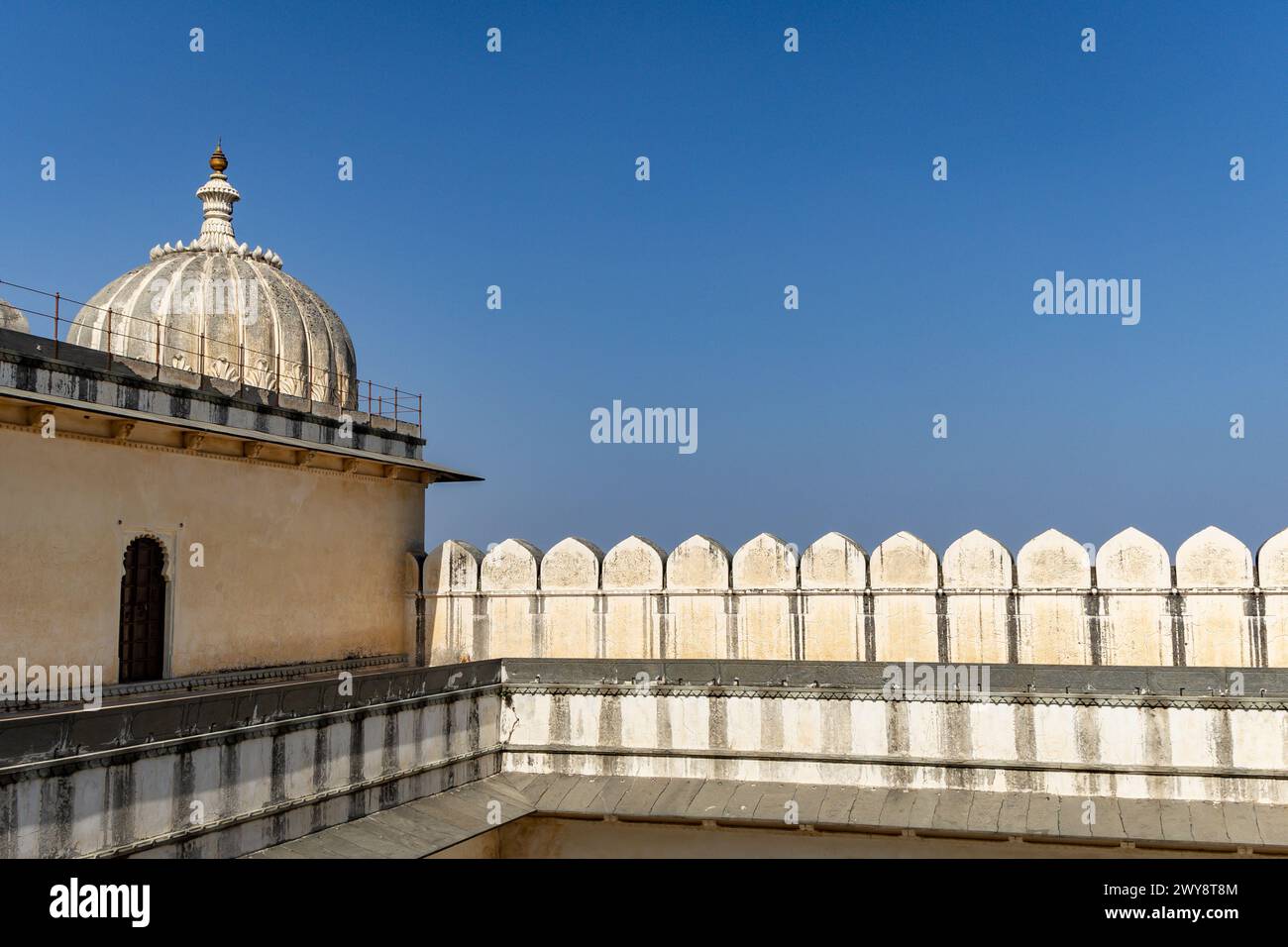 ancient fort stone wall with bright blue sky at morning image is taken ...