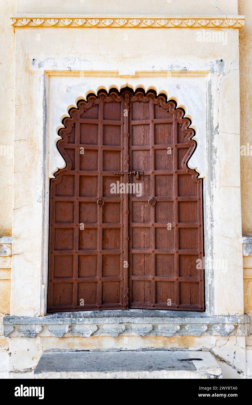 artistic wood door of ancient fort at morning image is taken at Kumbhal ...