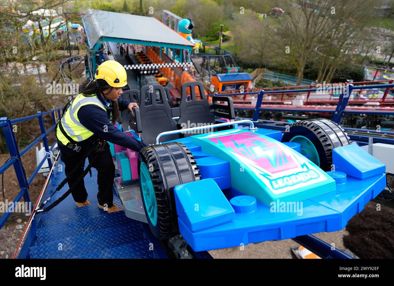 Legoland team member Shenica Gumbs inspects a car on the Minifigure ...