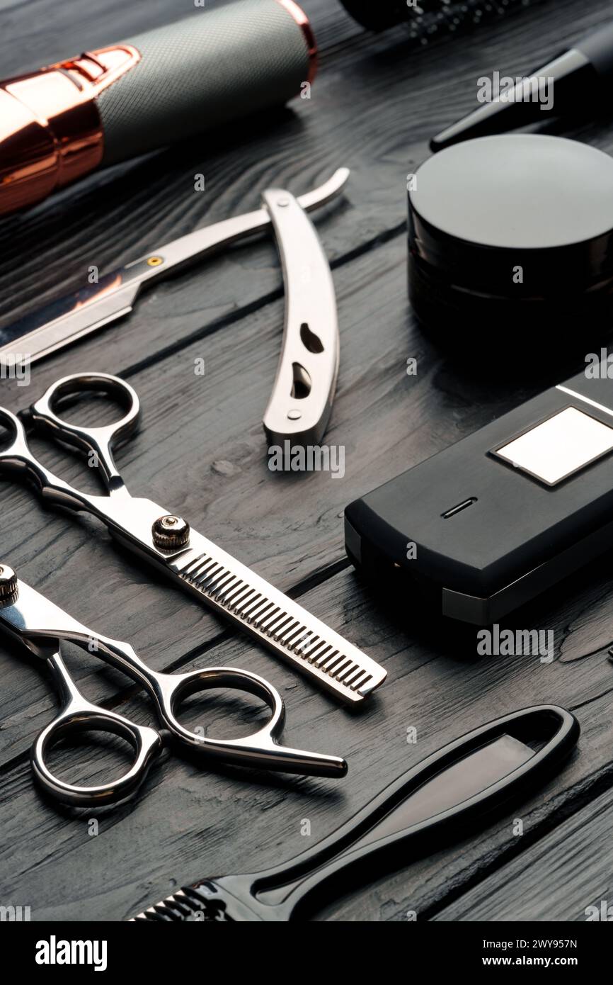 Professional Barber Tools Laid Out on Dark Wooden Surface Stock Photo ...