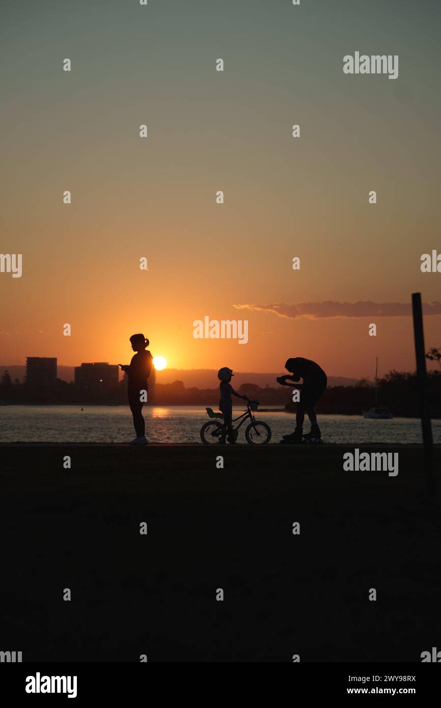 Family enjoying sunset river hi-res stock photography and images - Alamy
