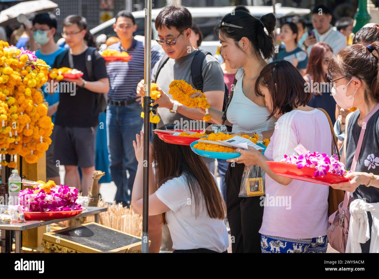 In the heart of downtown Bangkok, Thai locals and tourists alike gather at the Erawan Shrine ...