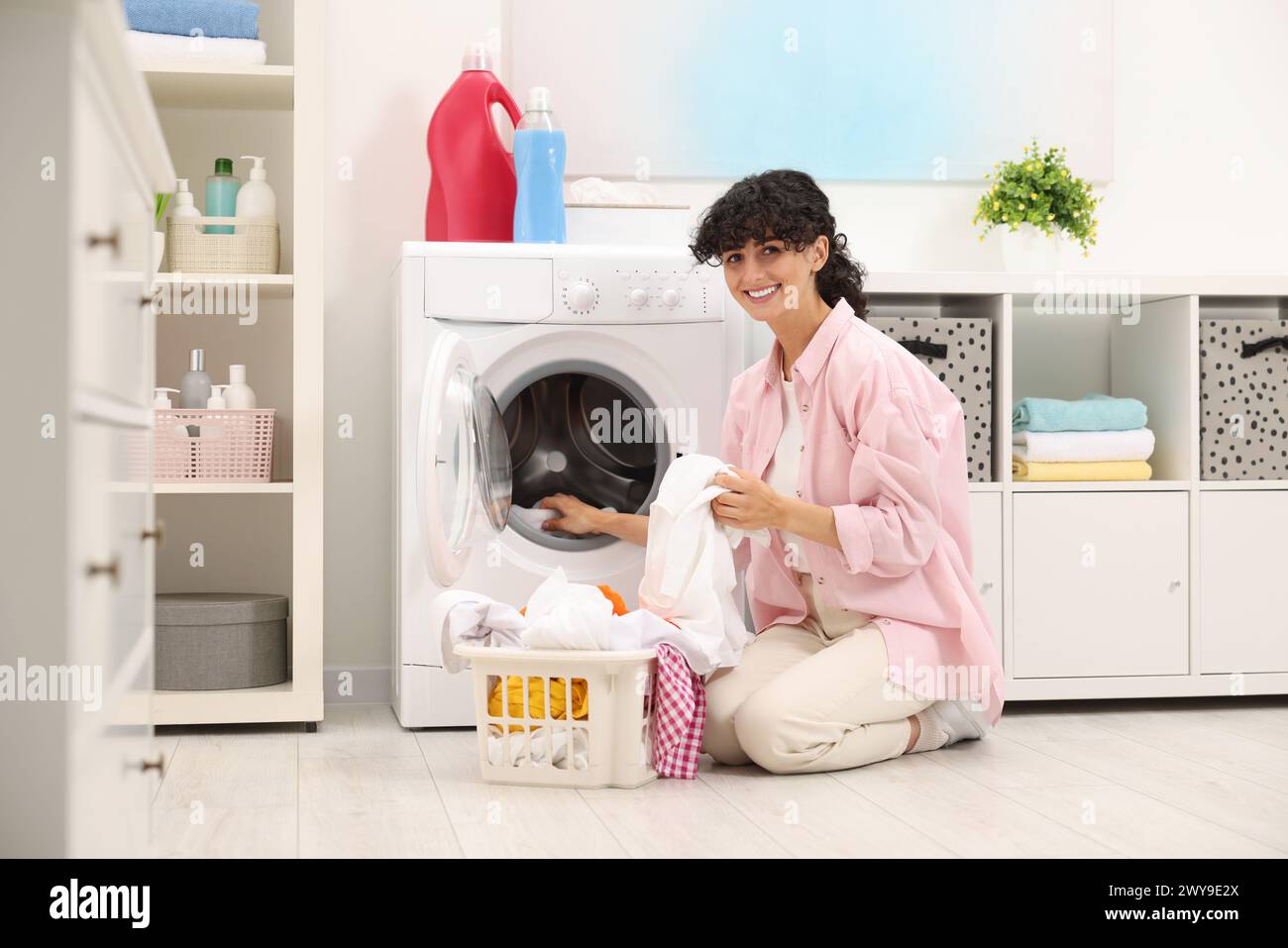 Young housewife washing machine clothes washing hi-res stock ...