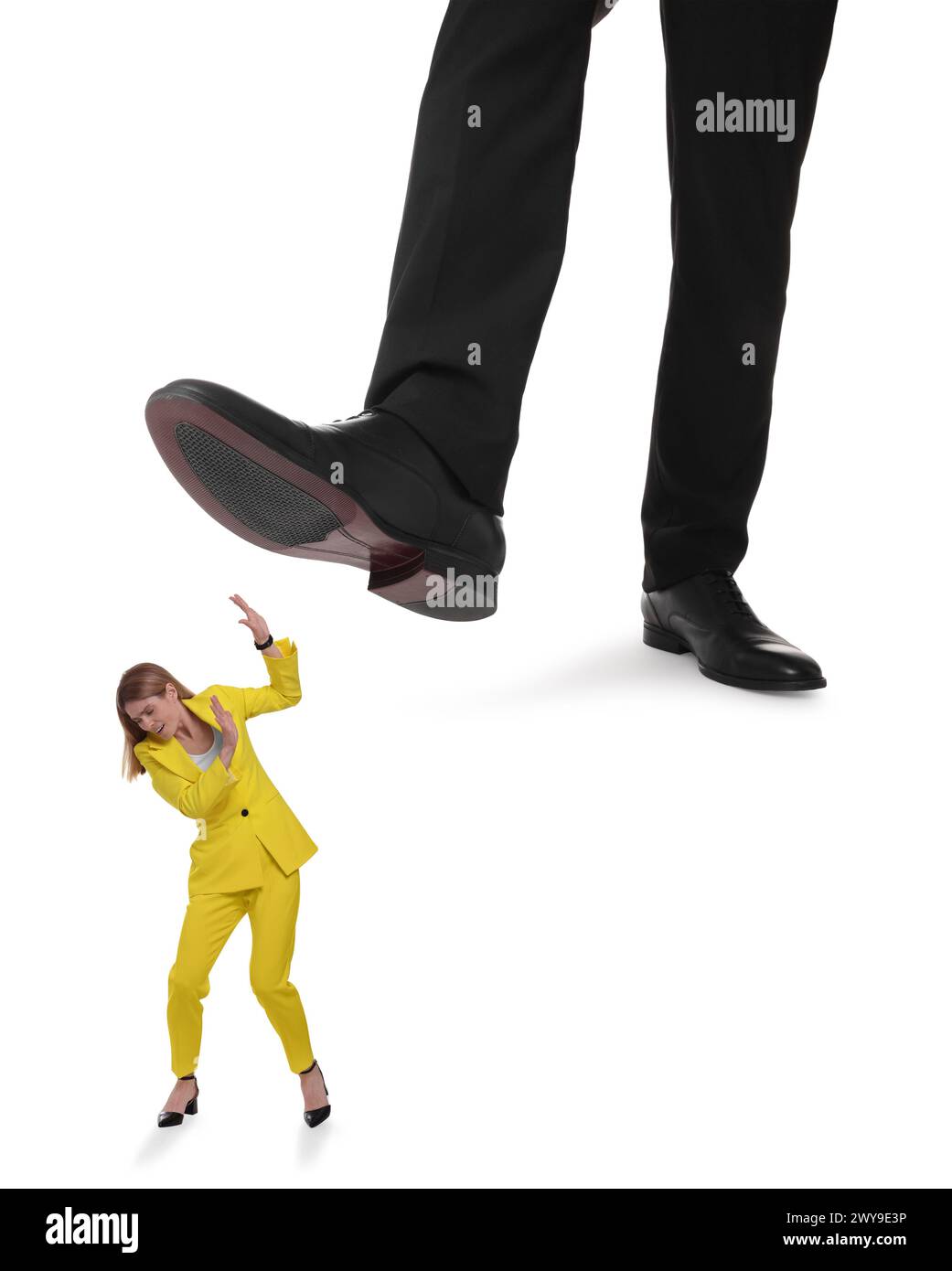 Big man stepping onto small woman on white background Stock Photo - Alamy