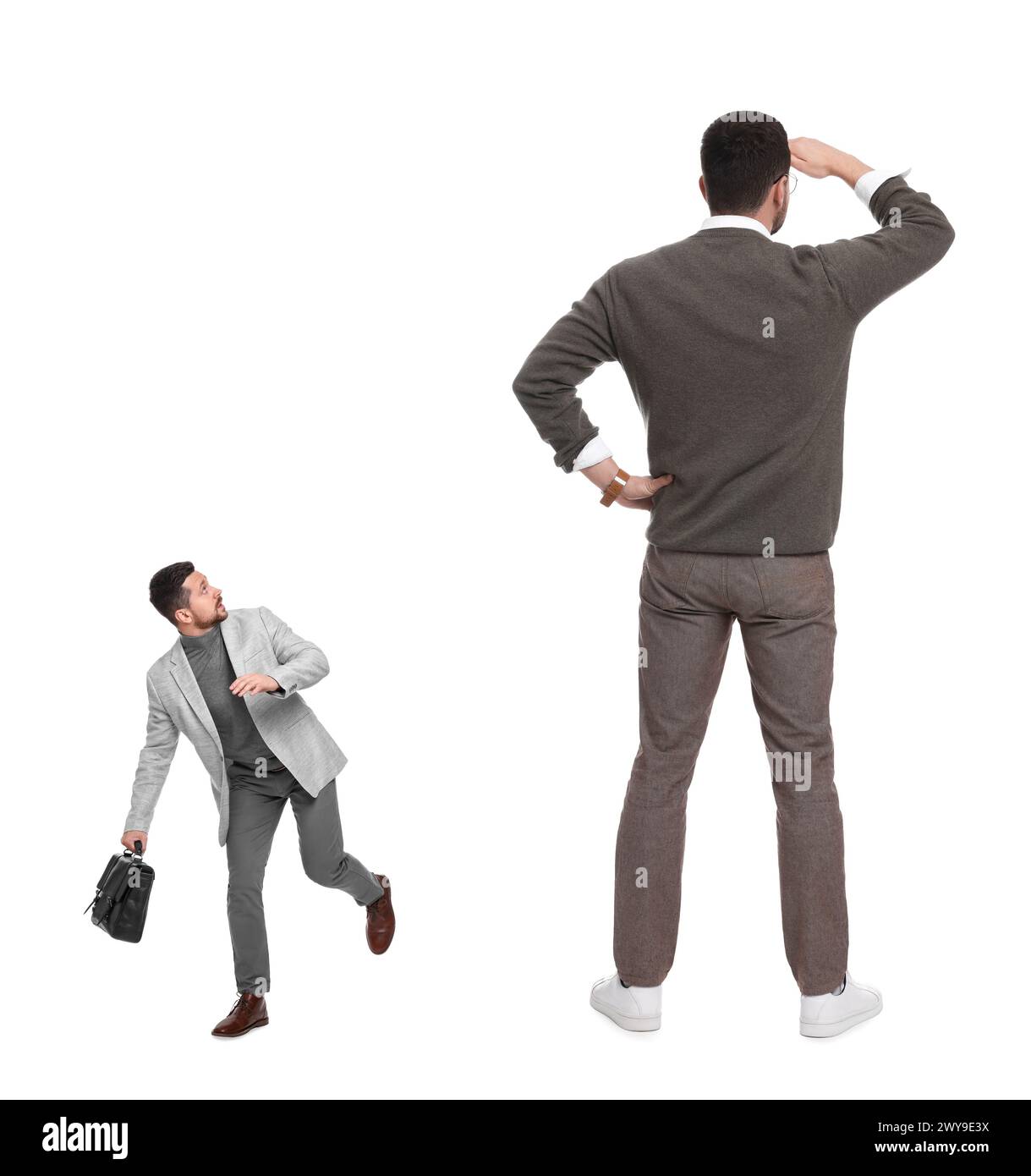 Small man running from giant boss on white background Stock Photo - Alamy