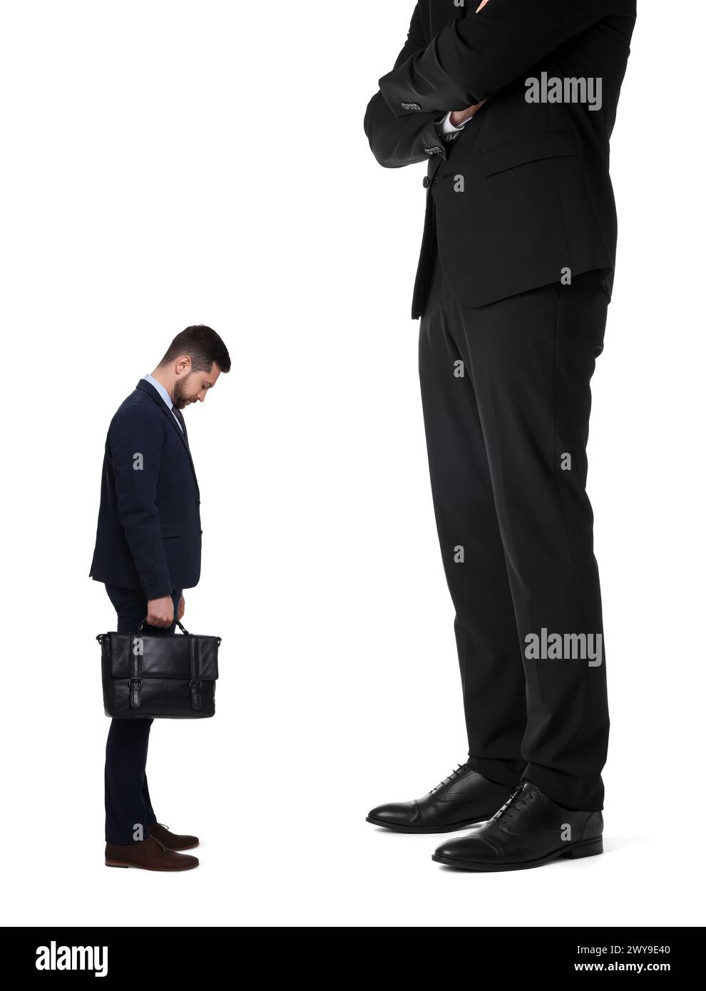 Giant boss and sad small man on white background Stock Photo - Alamy
