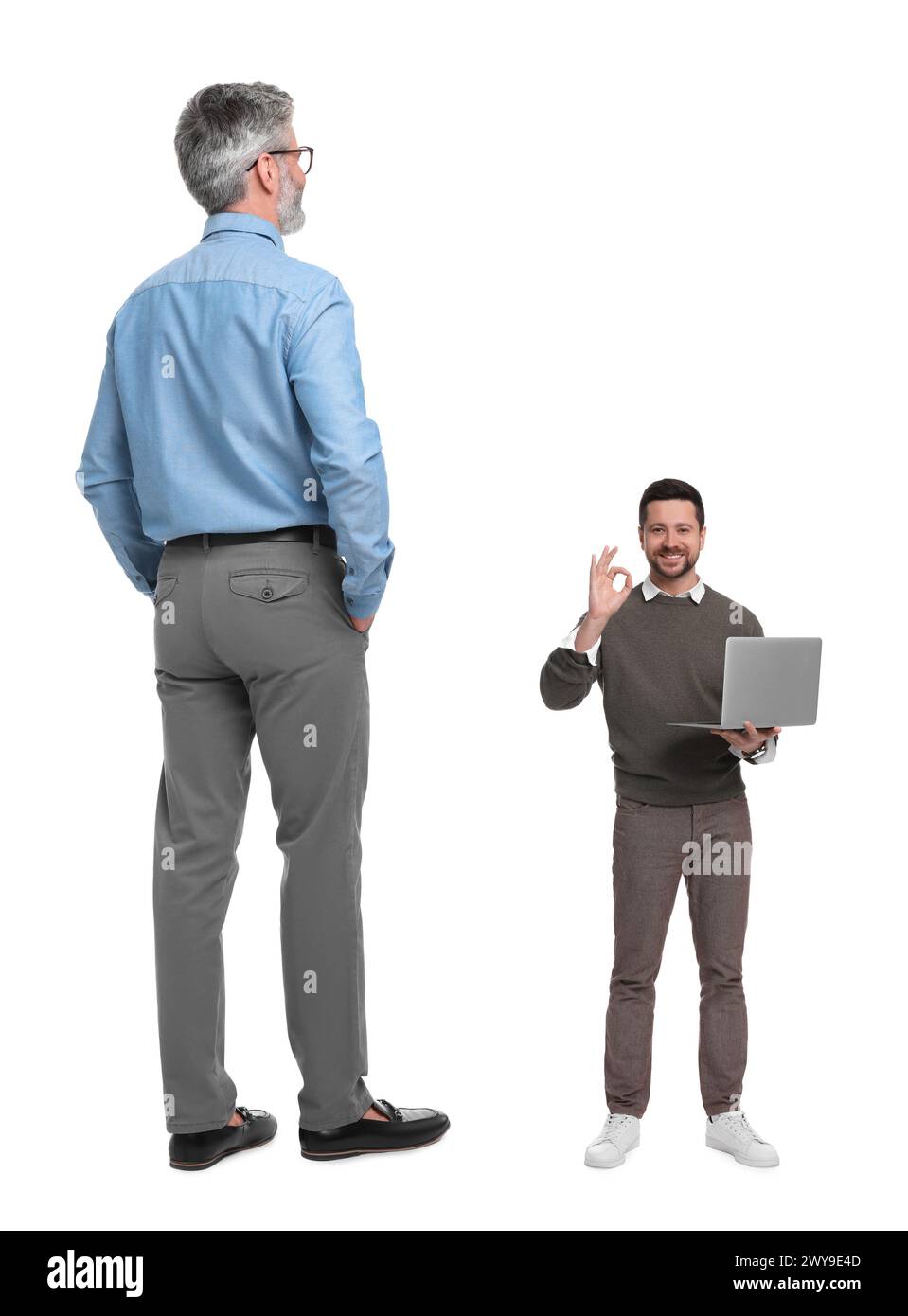 Giant boss and happy small man on white background Stock Photo - Alamy