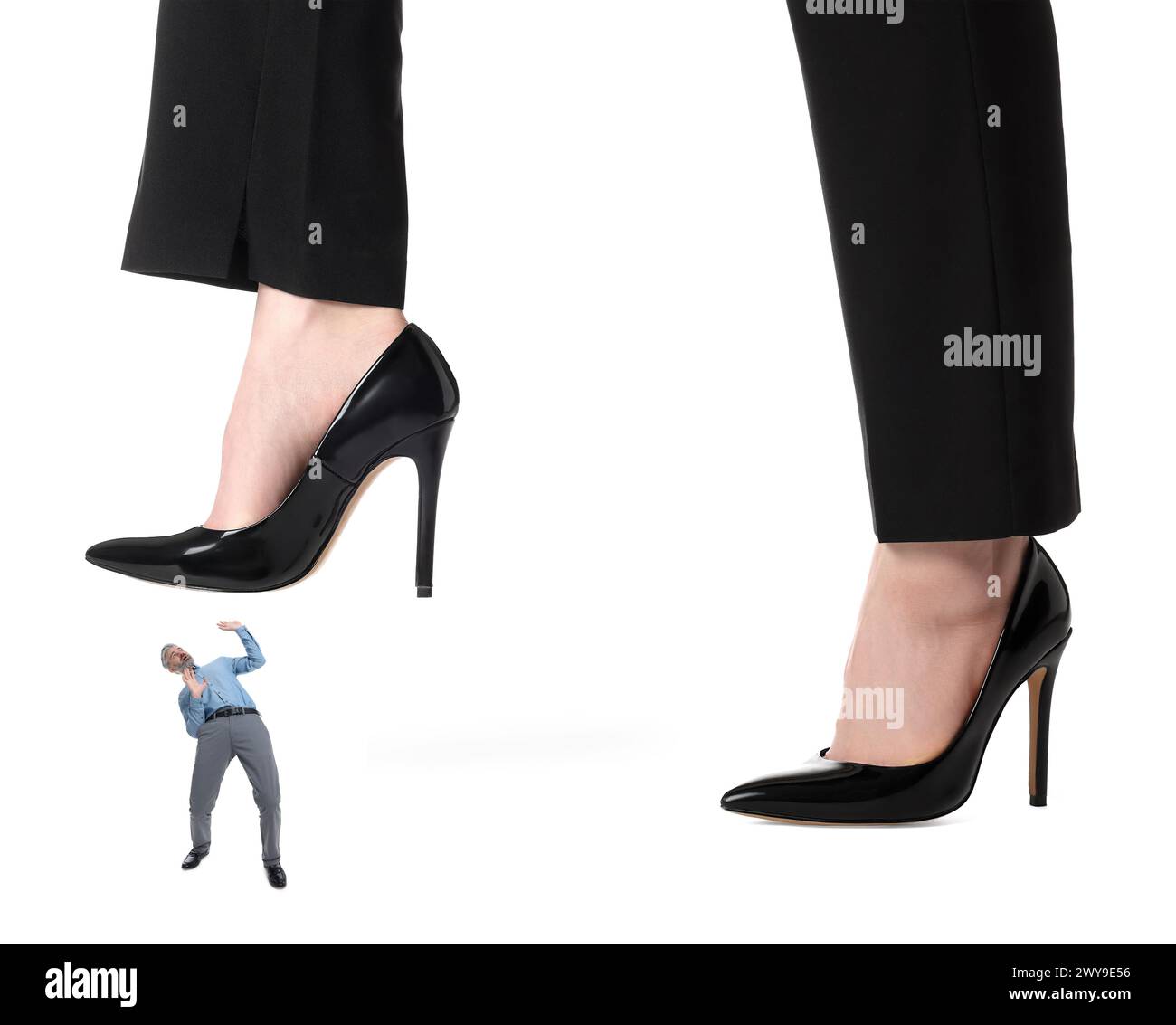 Big woman stepping onto small man on white background Stock Photo - Alamy