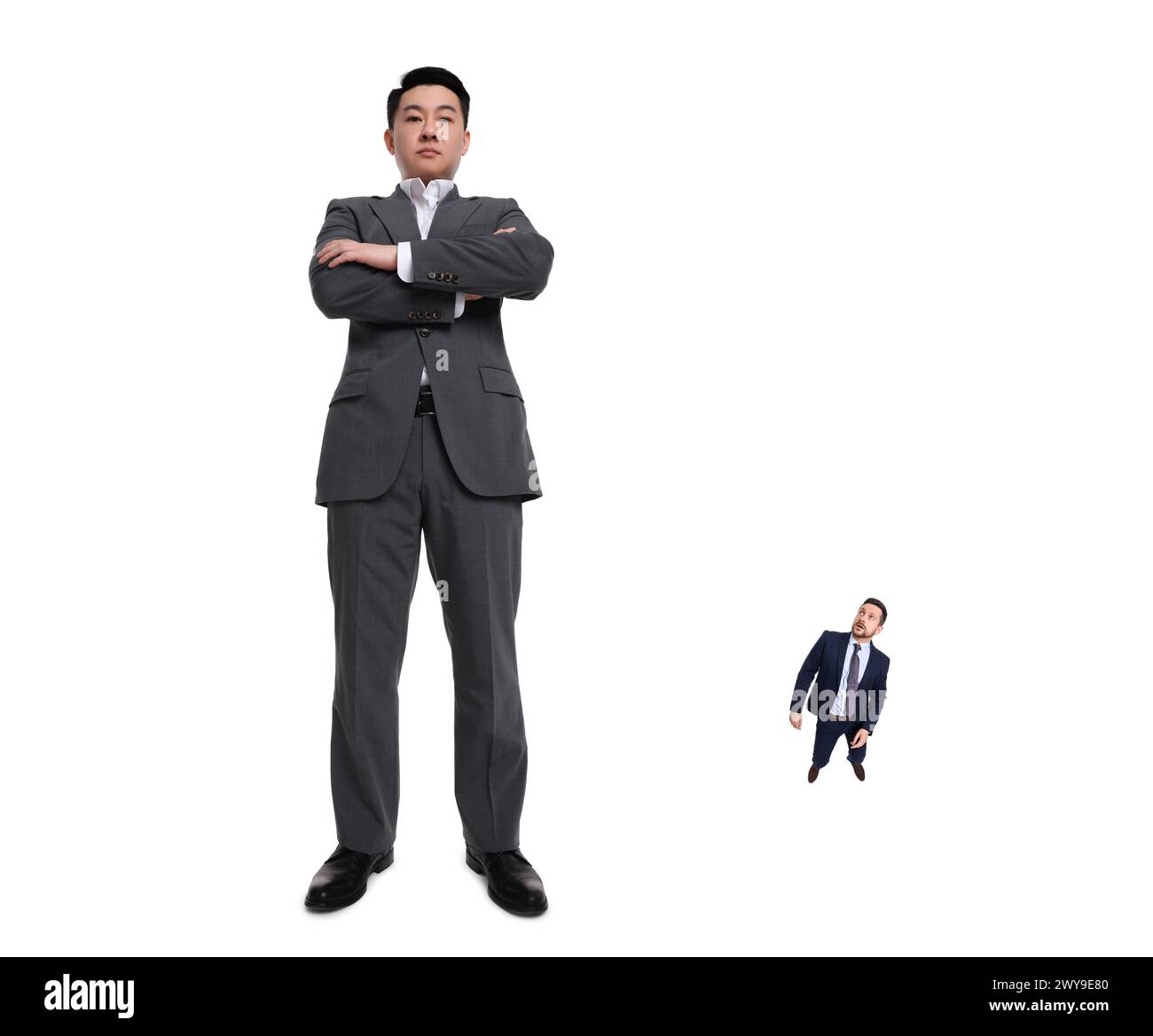 Giant boss and small man on white background Stock Photo - Alamy