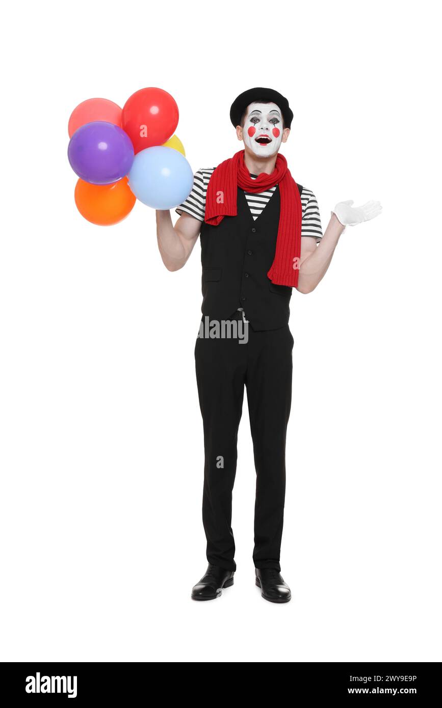 Funny mime artist with balloons posing on white background Stock Photo ...