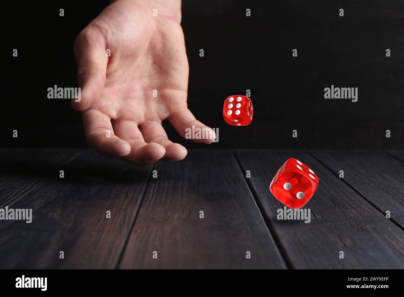 Wooden red and black dice hi-res stock photography and images - Alamy