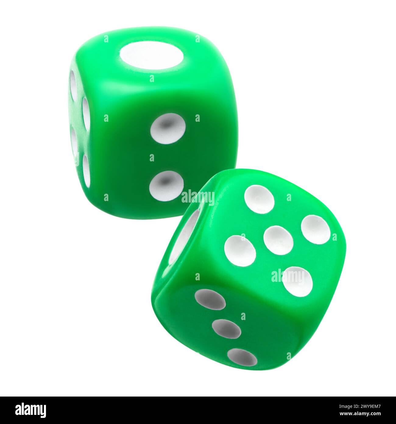 Two green dice in air on white background Stock Photo - Alamy