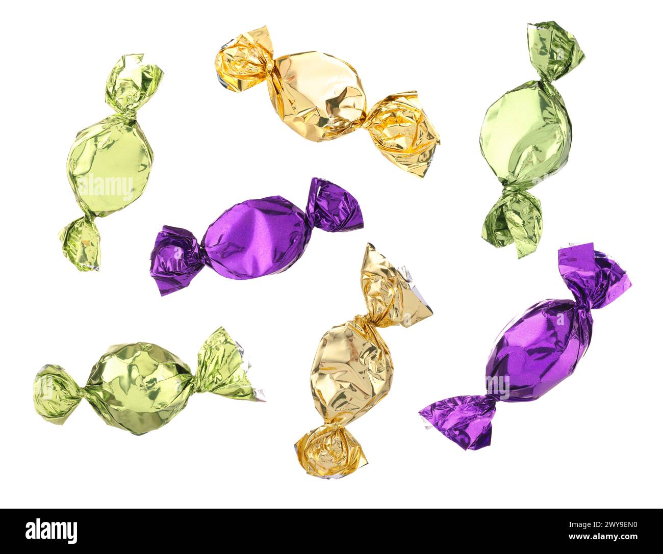 Candies in bright wrappers falling on white background Stock Photo - Alamy