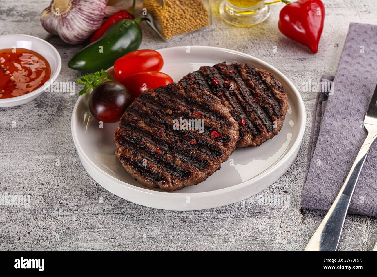 Grilled beef burger cutlet with sauce Stock Photo - Alamy