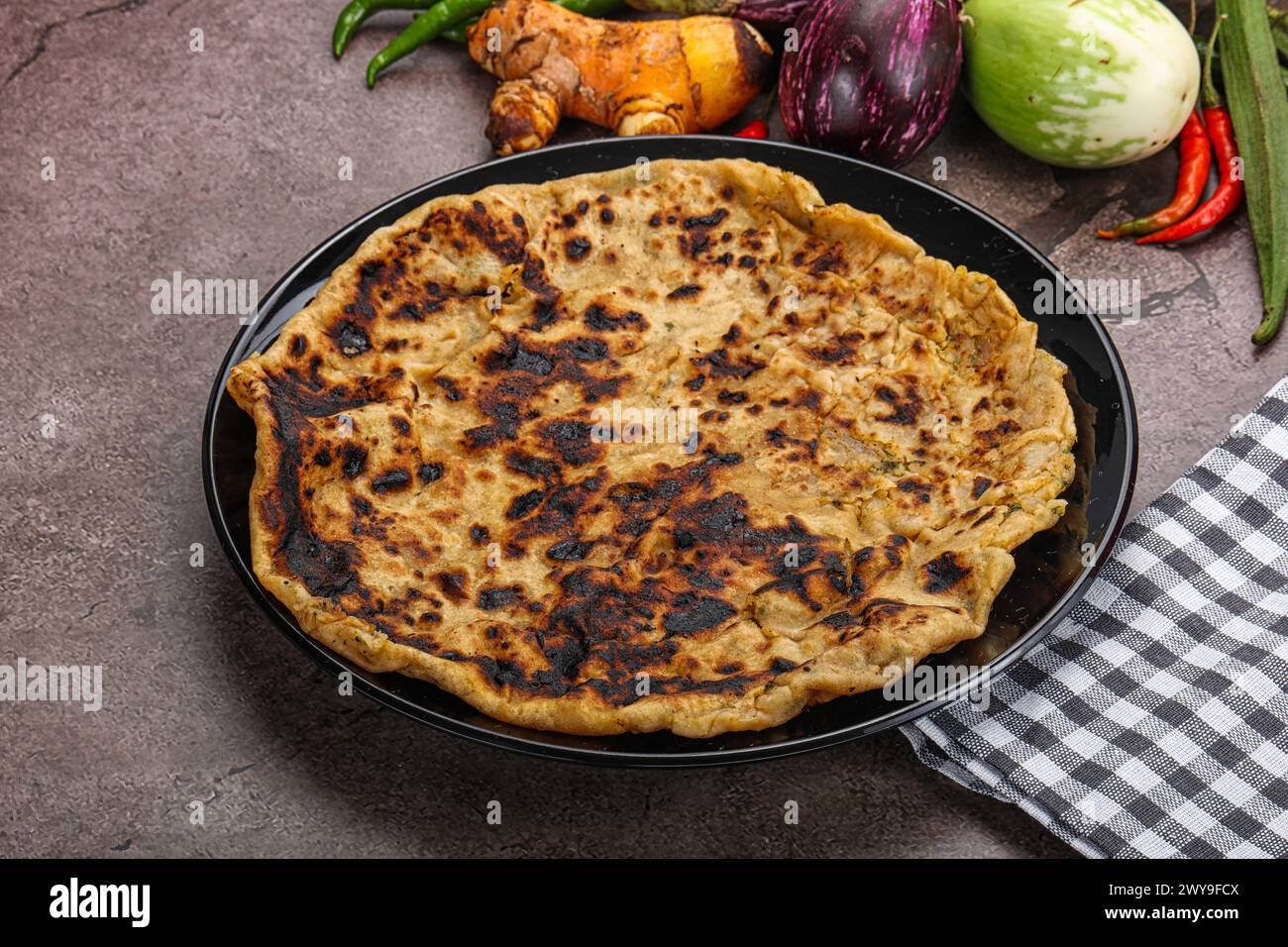 Indian cuisine stuffed Aloo paratha - bread with potato Stock Photo - Alamy