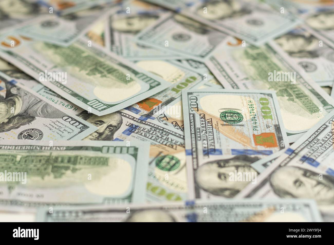 Very big amount of US hundred dollar bills close up. Huge quantity of ...