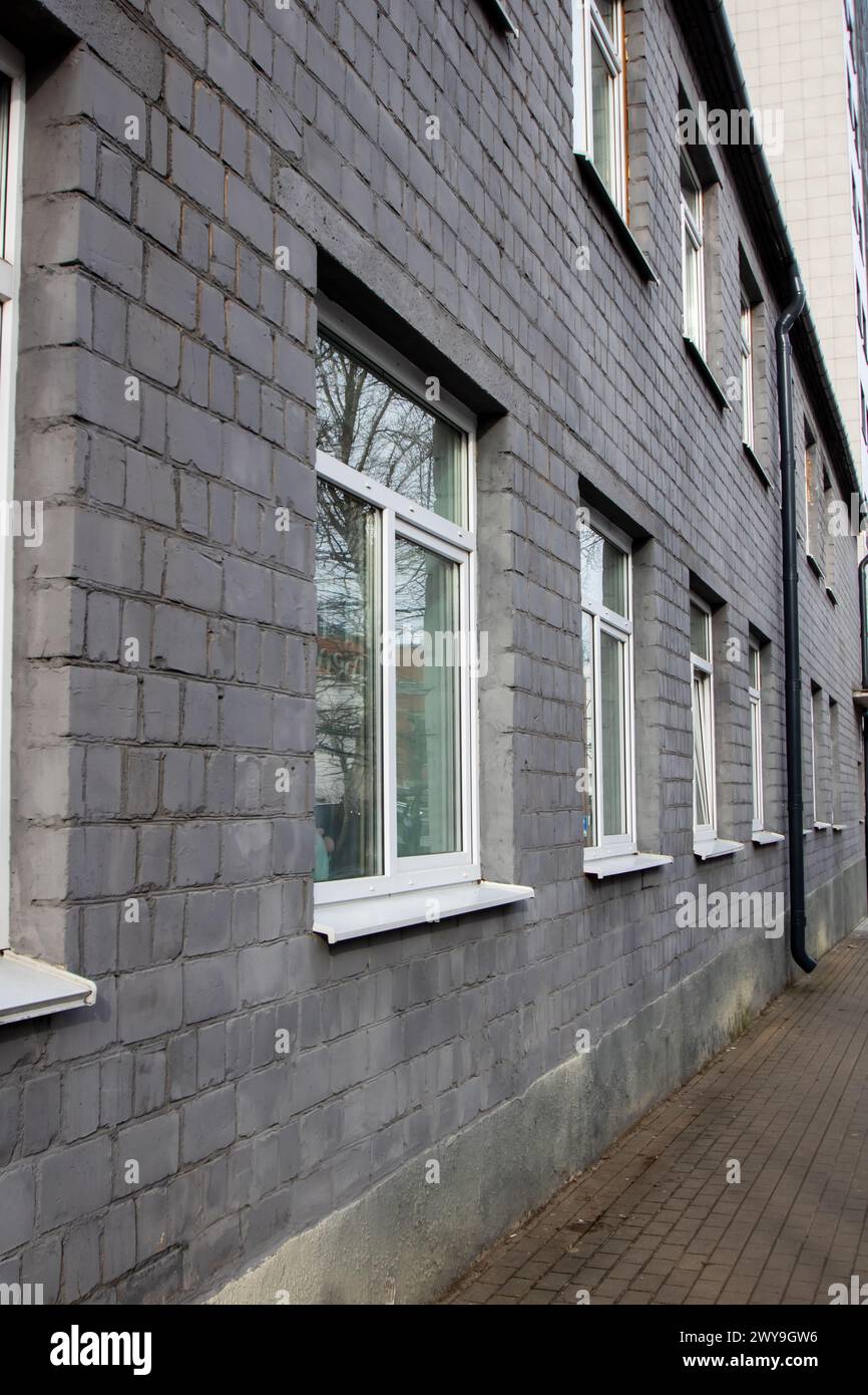 Windows on a modern two-storey building close up Stock Photo - Alamy
