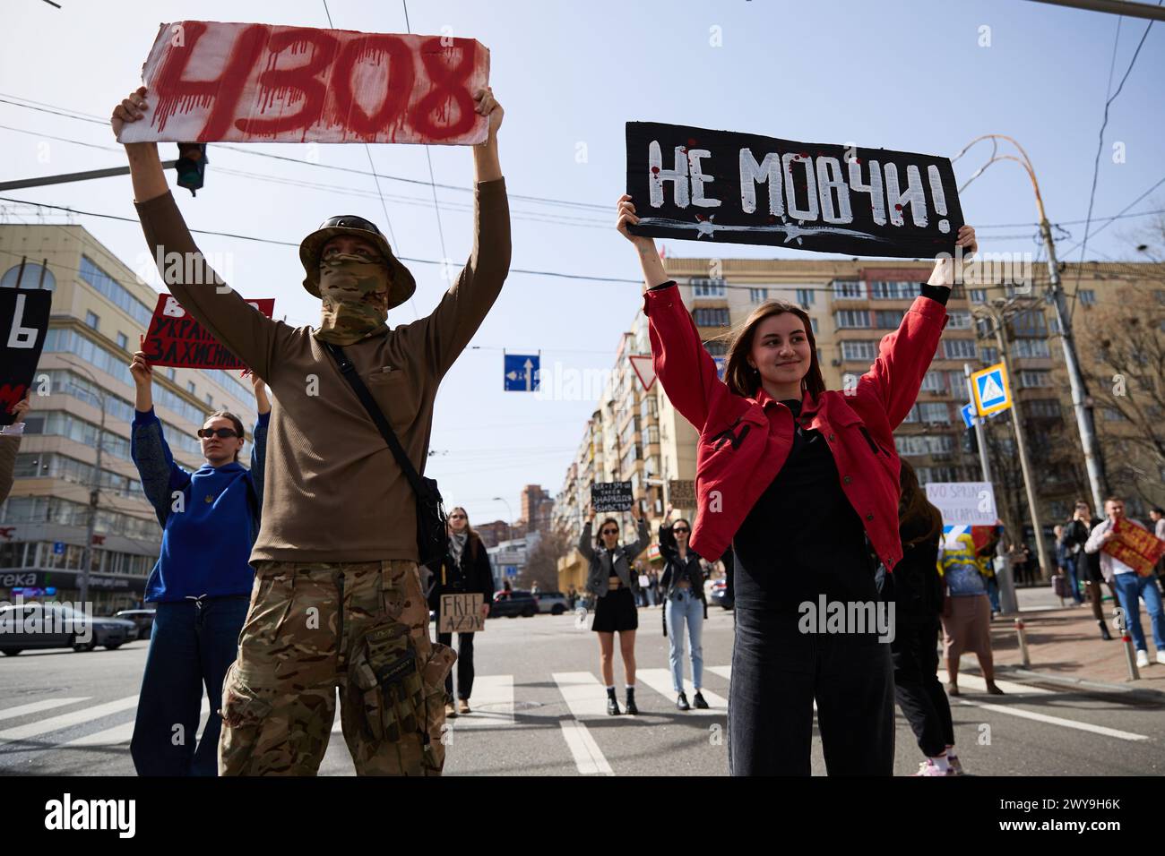 Ukrainians demonstrating with banners "4308" and "Don't Be Silent" at a ...