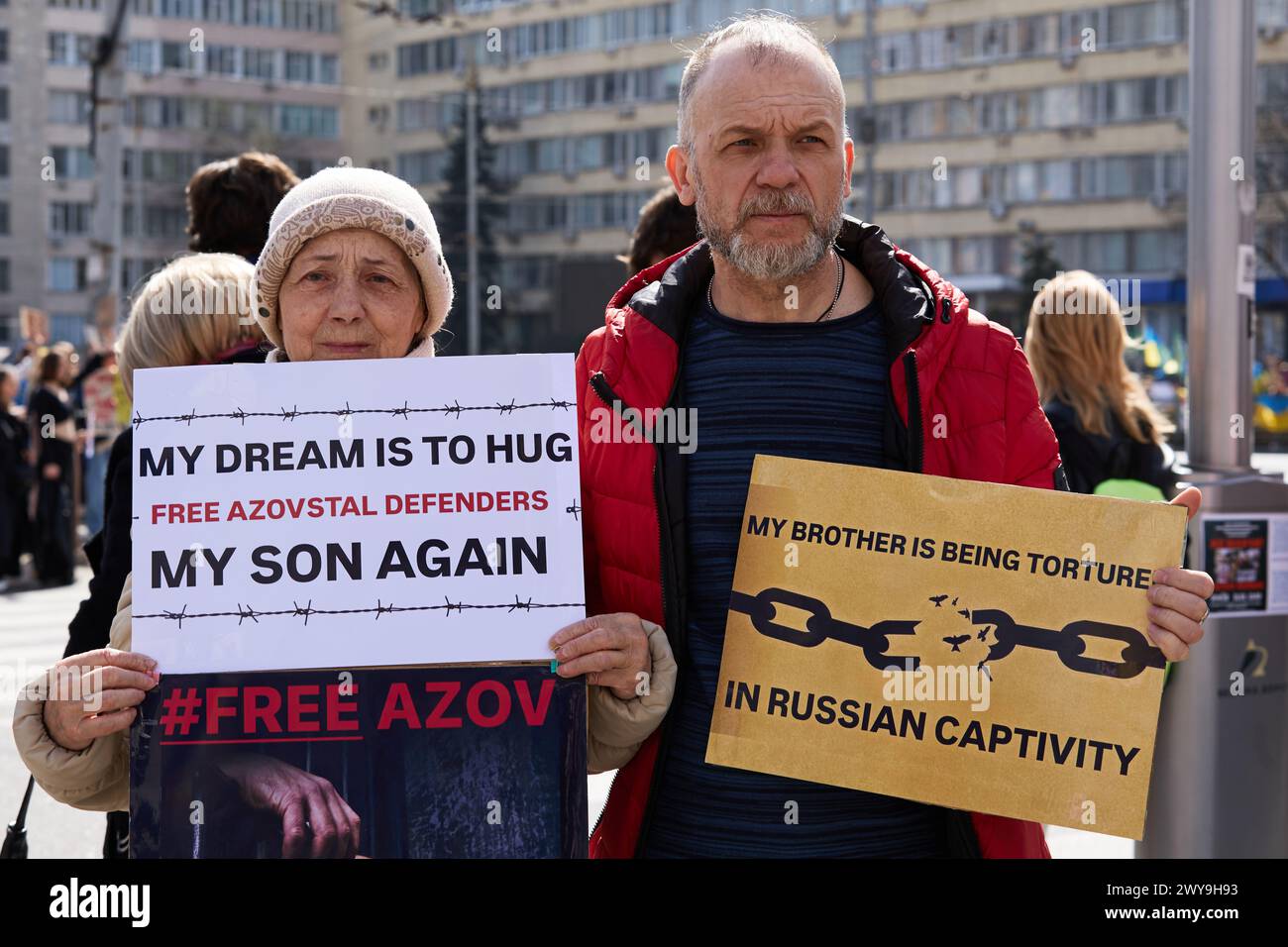 Sad Ukrainian family posing with banners dedicated to their captured ...