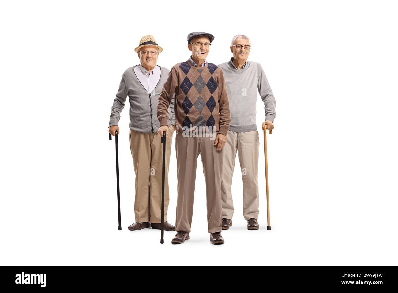 Full length portrait of three senior men standing with canes isolated ...