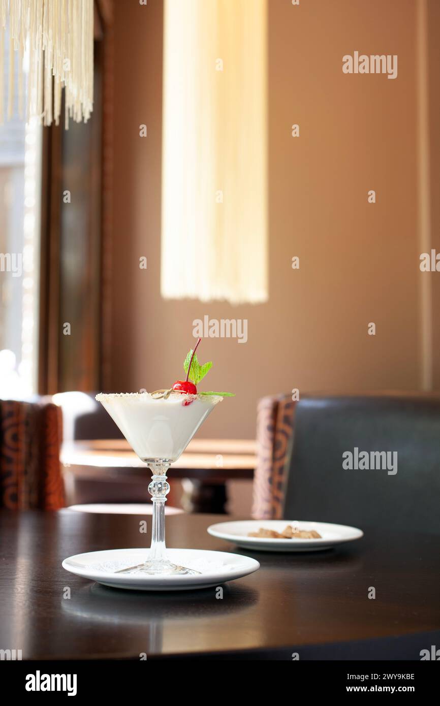 Martini glass with drink in dining room environment Stock Photo - Alamy
