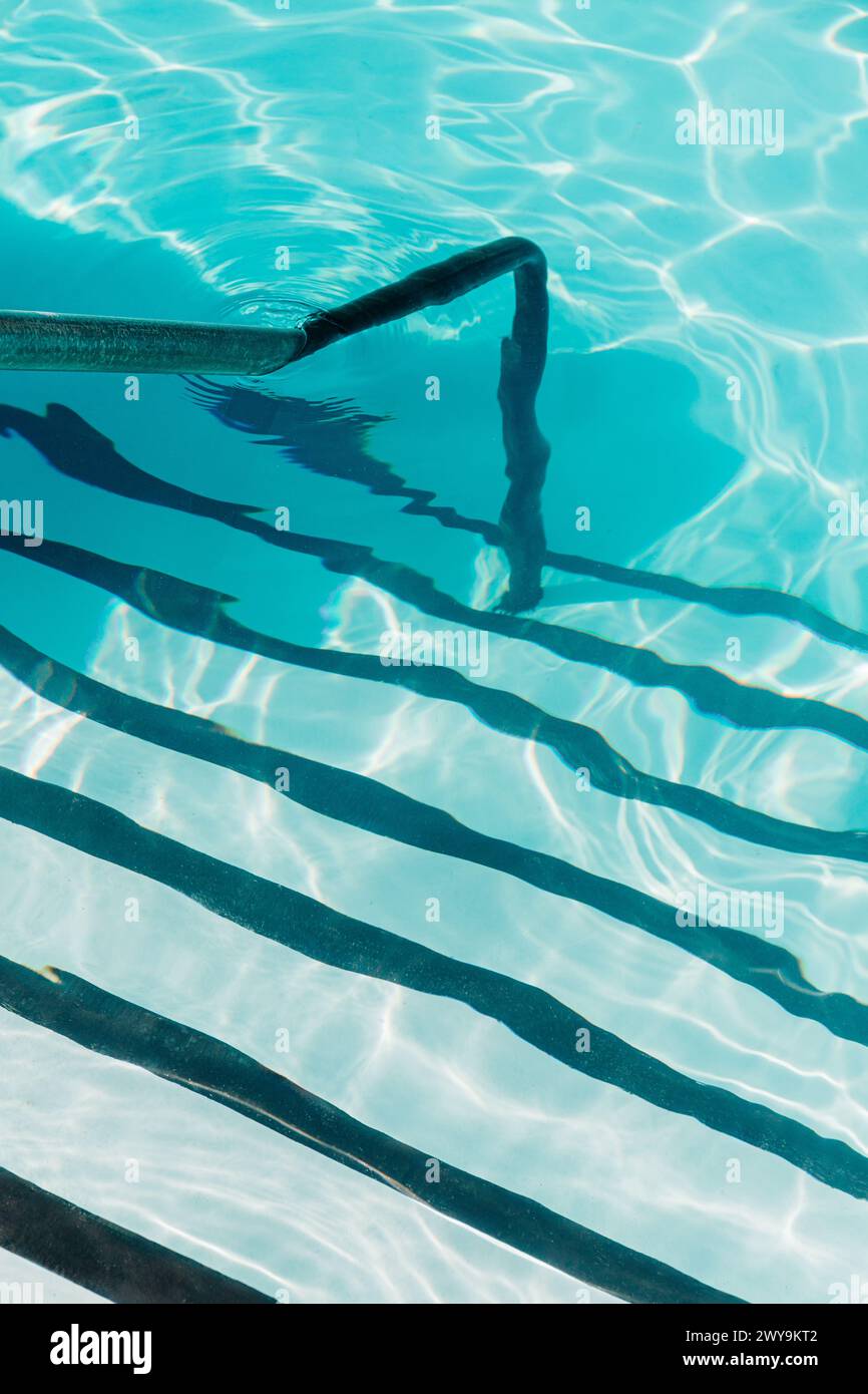 Pool steps and handrail in the summer sun Stock Photo - Alamy