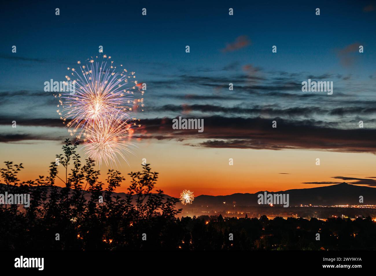 Sunset sky with bursting fireworks over Missoula Valley Stock Photo - Alamy