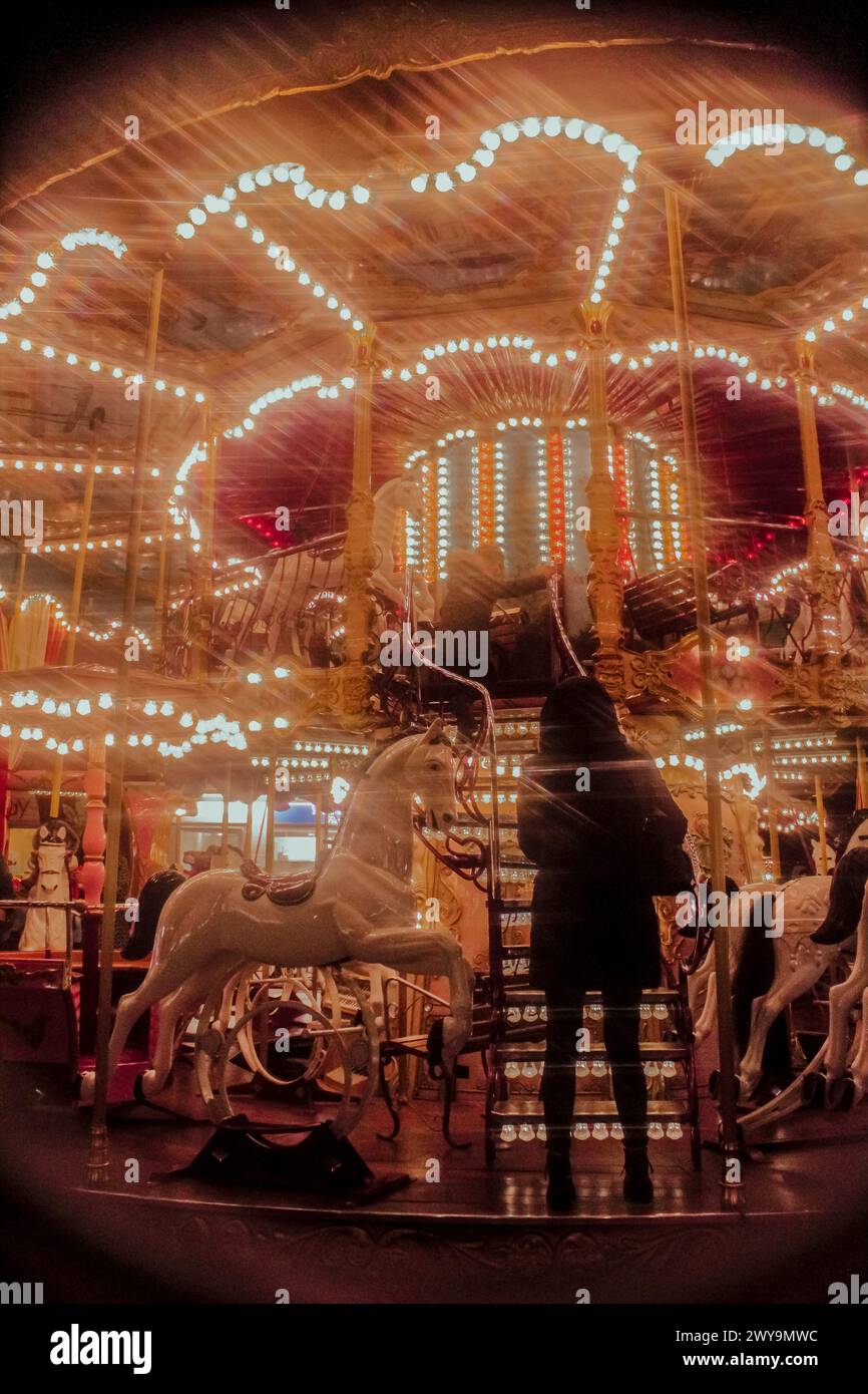 bright light carousel with horses Stock Photo - Alamy