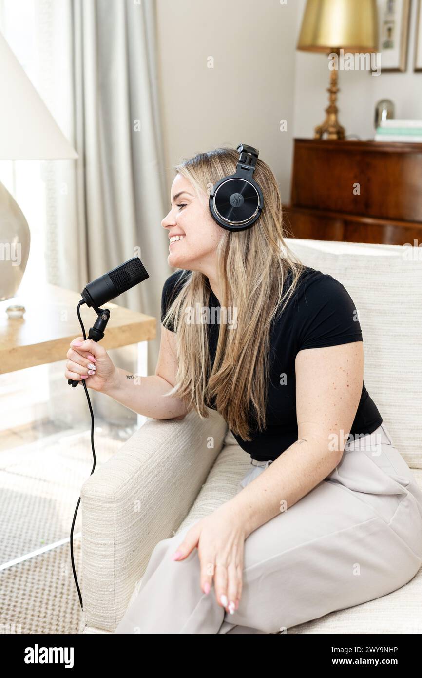 Woman microphone recording podcast hi-res stock photography and images ...