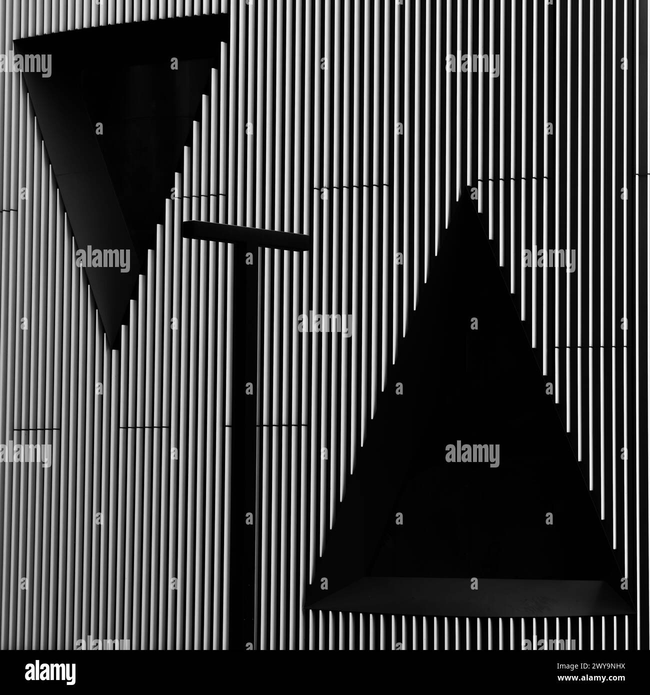 A monochrome textured background with two triangles Stock Photo - Alamy