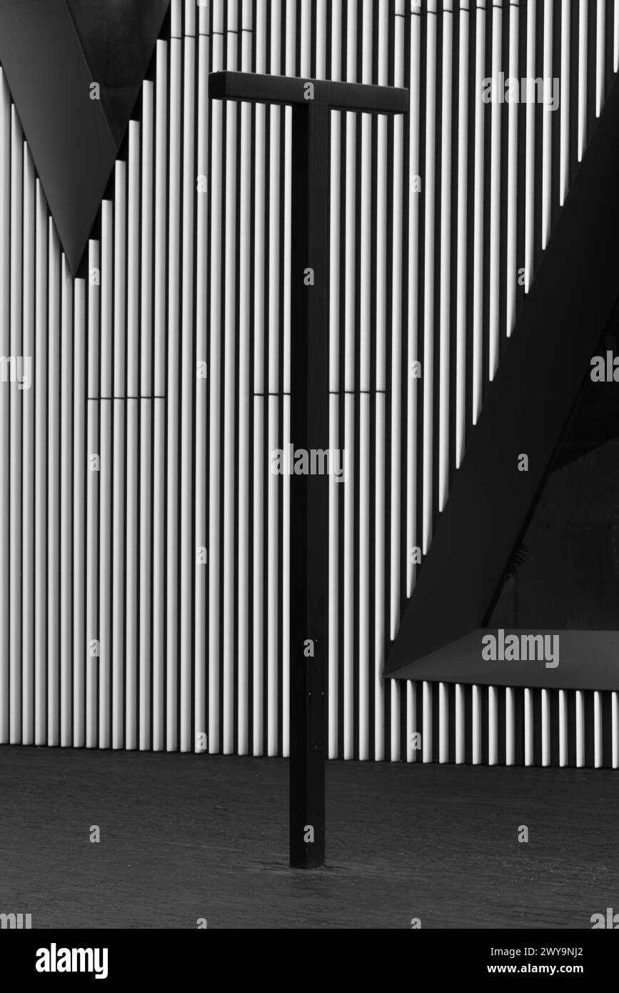 A t-shaped post against a monochrome textured backdrop Stock Photo - Alamy